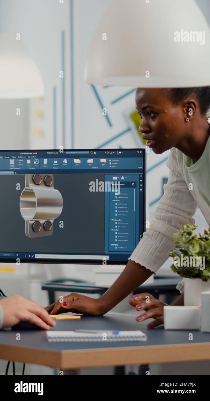 Industrial engineer and african project manager working on 3D ...