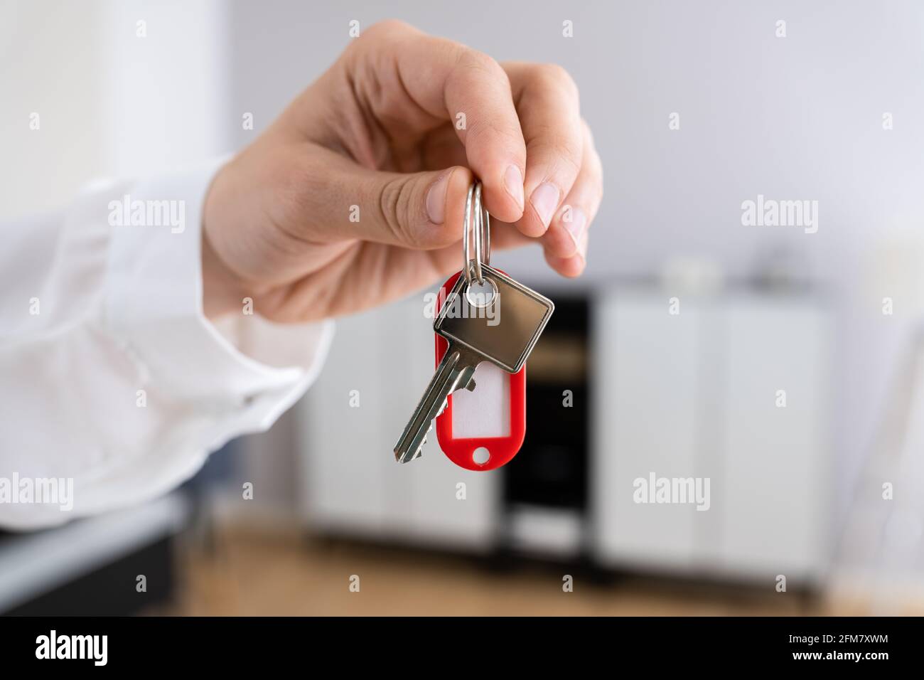 Holding key keys hi-res stock photography and images - Alamy