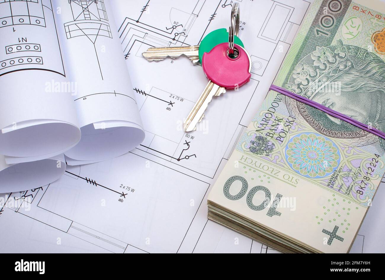 Home keys and polish currency money on electrical construction drawing ...