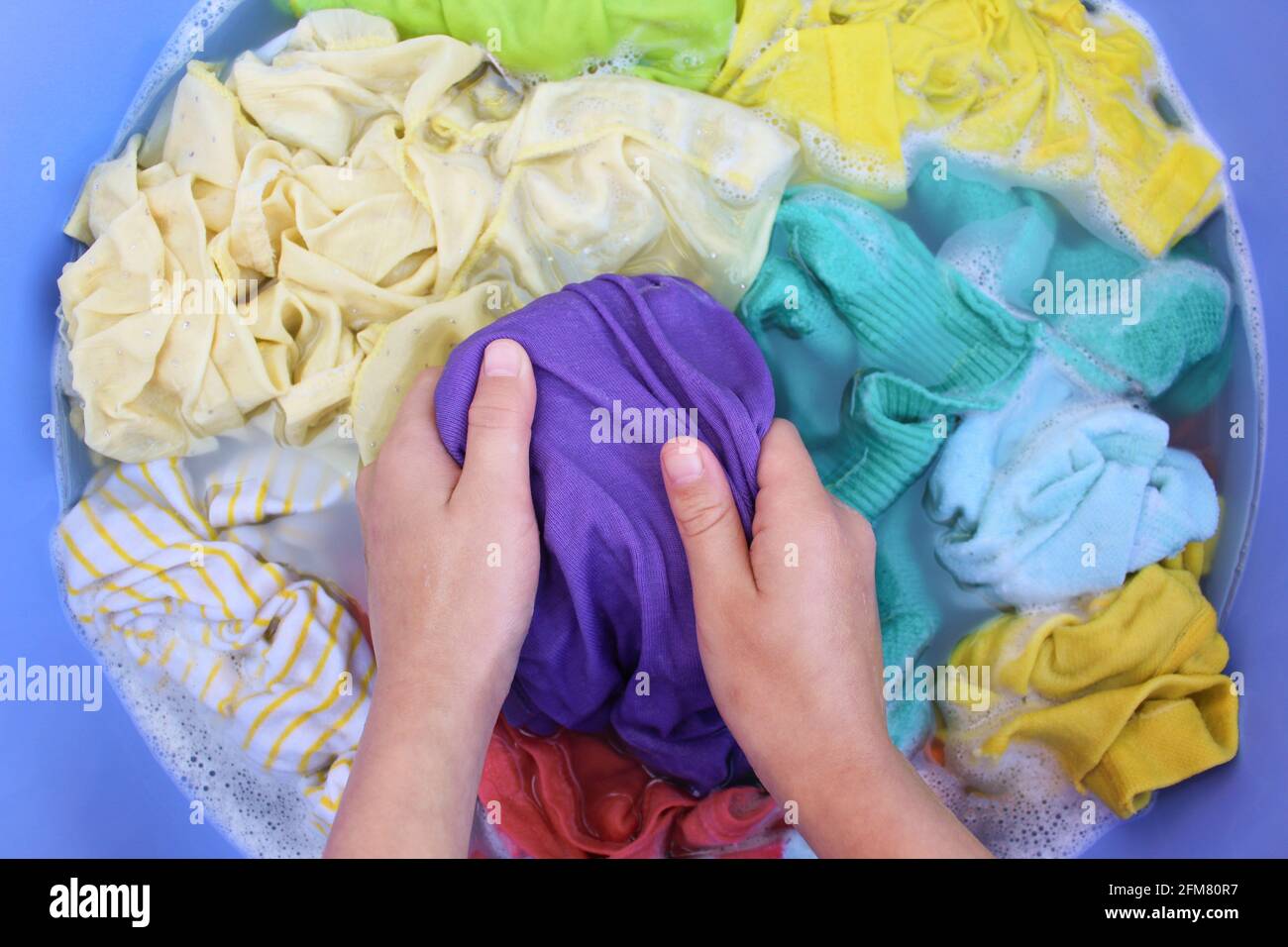 Clothes in basin hi-res stock photography and images - Alamy
