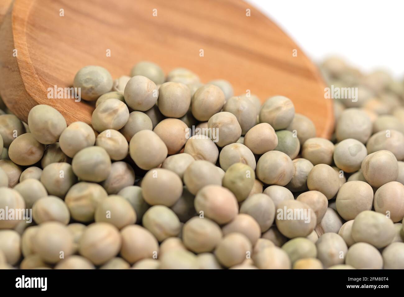 Dried peas on a wooden spoon Stock Photo - Alamy