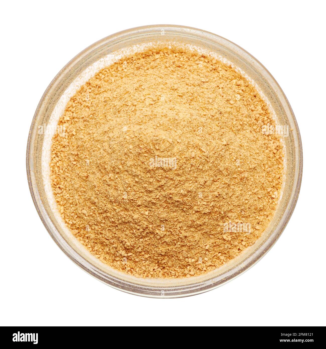 grinded organic ginger spice in ghass bowl isolated on white background ...