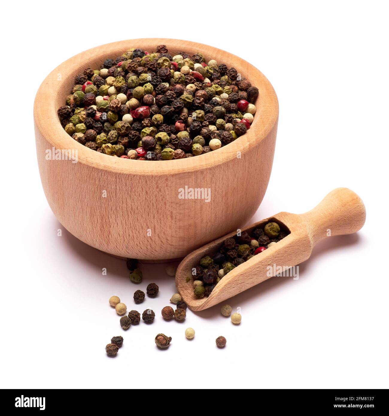 black round pepper spice in wooden bowl or mortar on white background ...