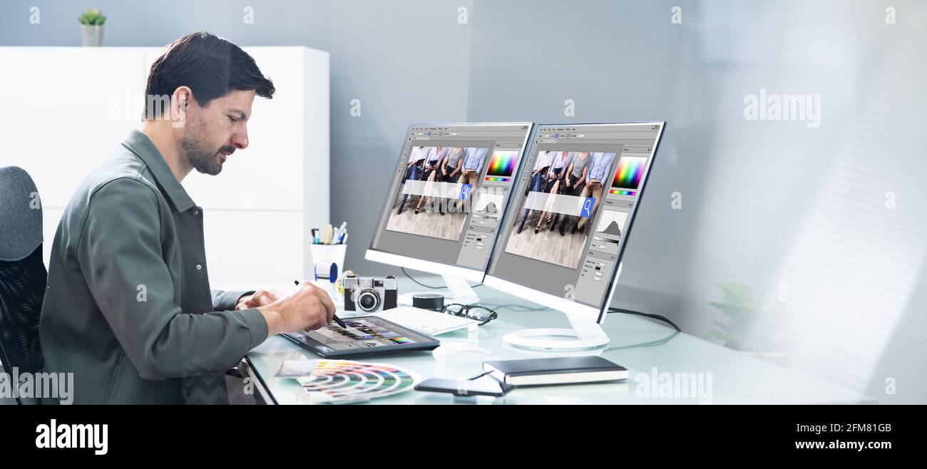 Graphic Photo Designer Using Computer Screen And Tablet Stock Photo - Alamy