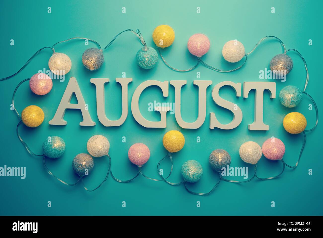 August alphabet letter with cotton ball LED decoration on blue ...