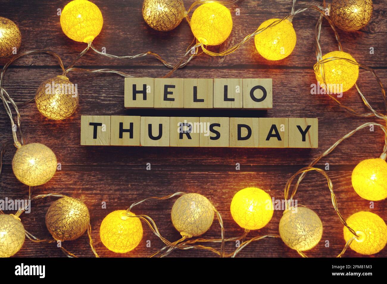 Hello Thursday alphabet letter with LED cotton balls on wooden ...