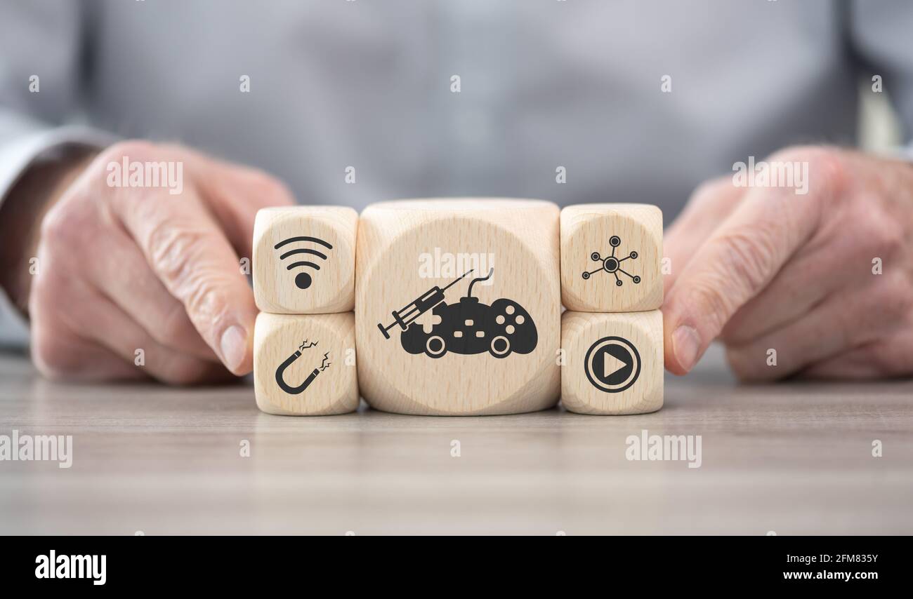Wooden blocks with symbol of video game addiction concept Stock Photo ...