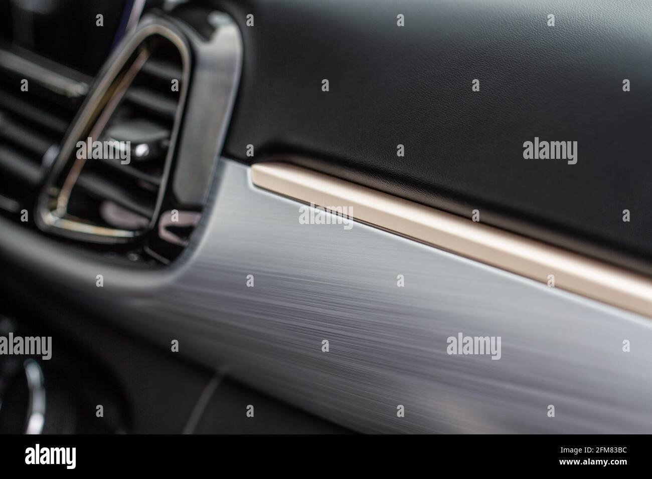 Modern car interior close up view with metallic and plastic details ...