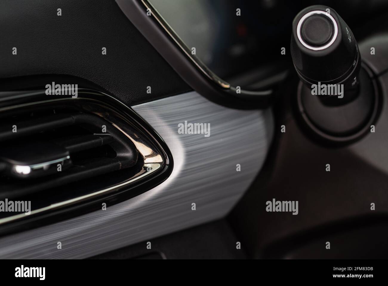 Modern car interior close up view with metallic and plastic details ...