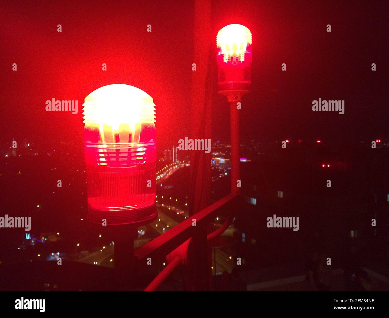 Bright red lamps on the background of night city Stock Photo - Alamy