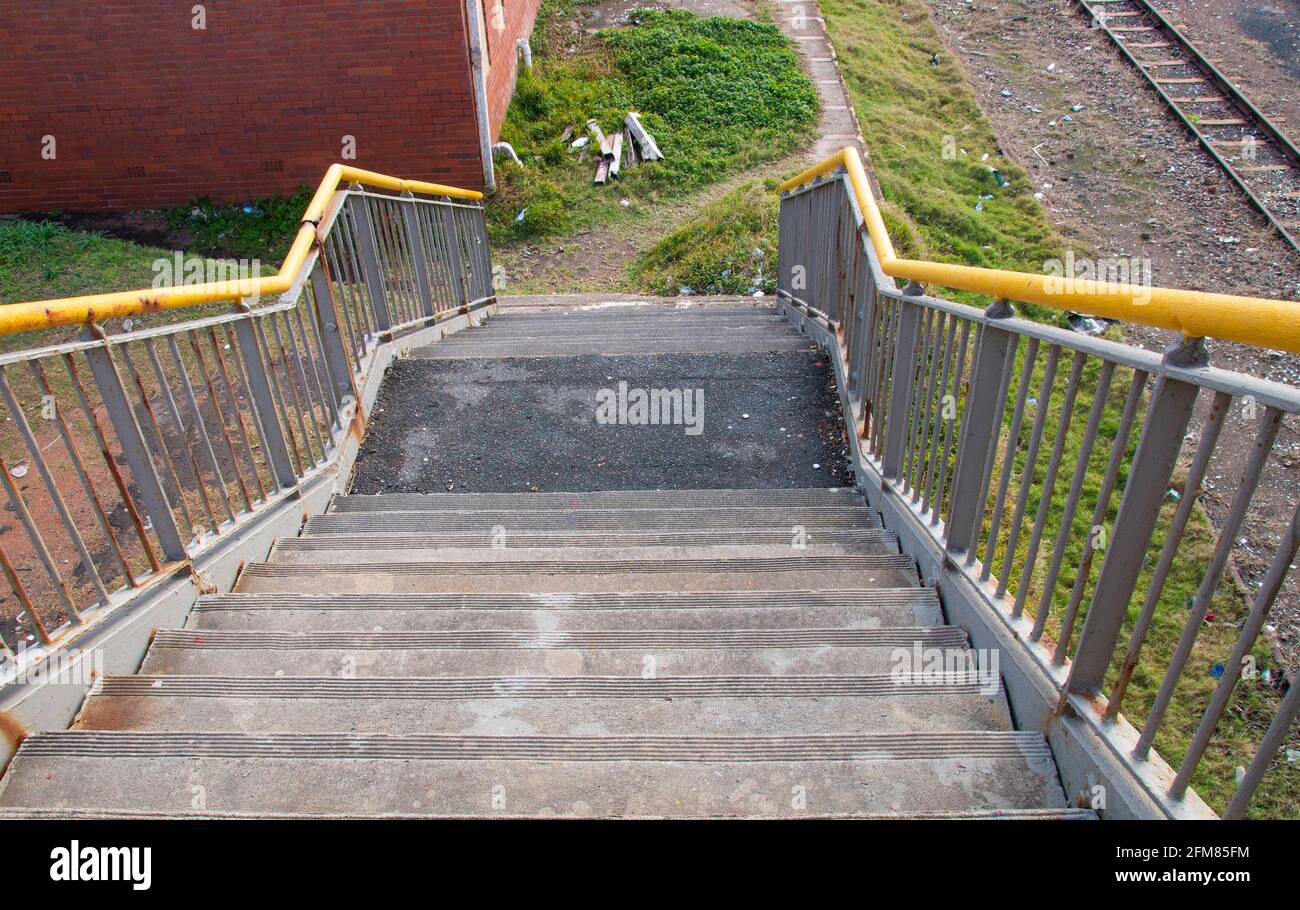 Descending cement stairway from pedestrian railway bridge Stock Photo ...