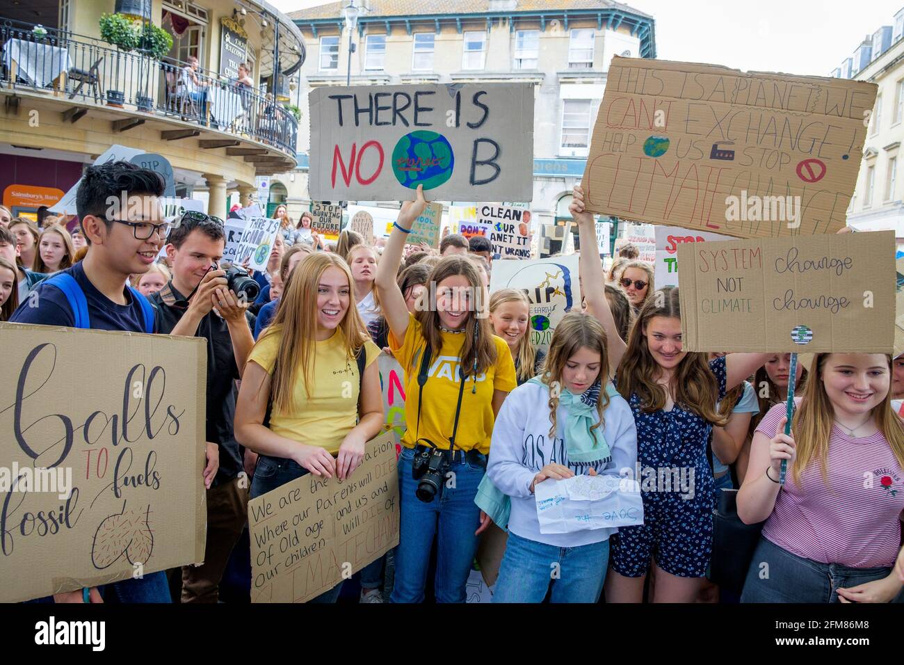 Bath college students and school kids carrying climate change placards ...