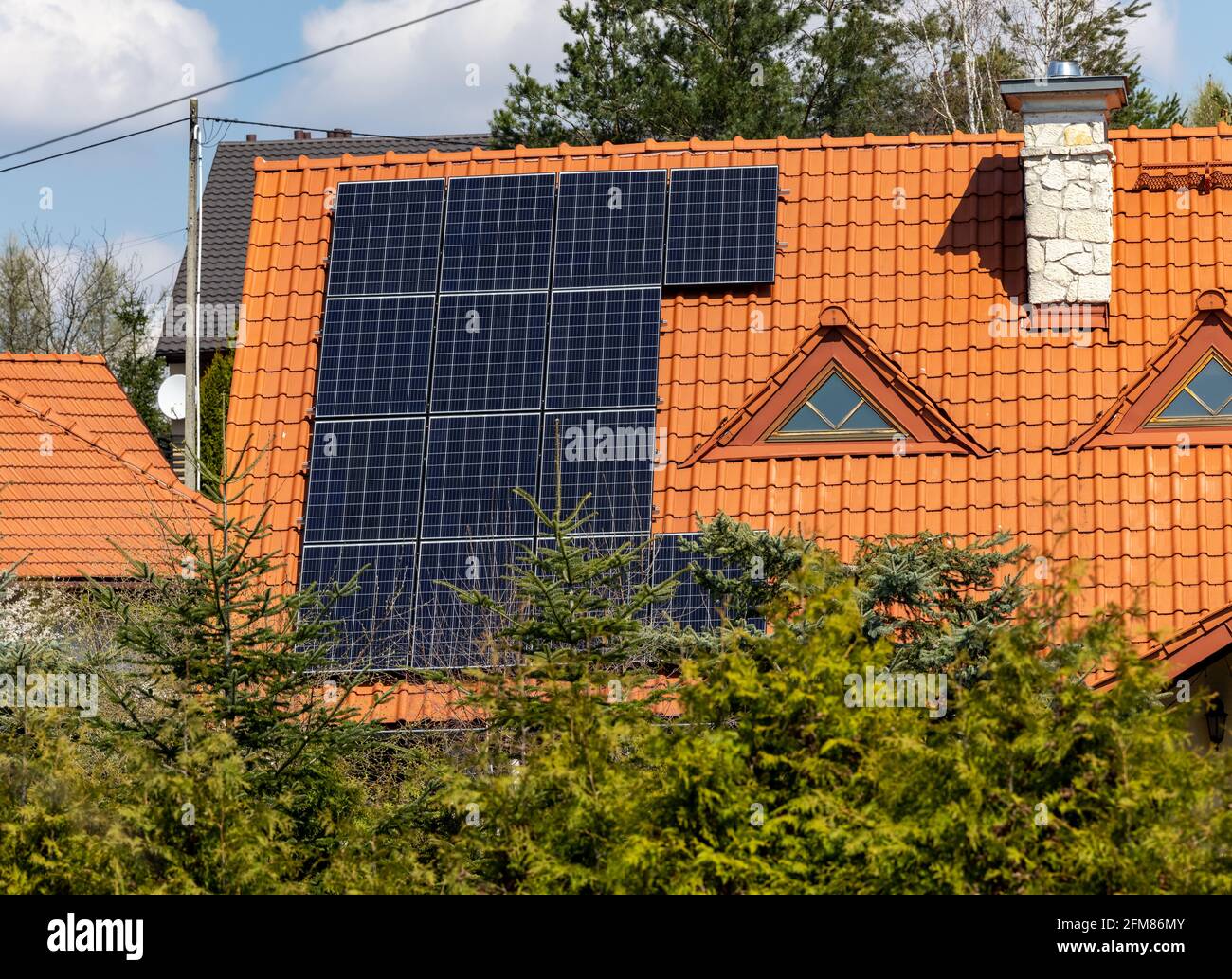 Solar electric panels on a house roof Stock Photo - Alamy