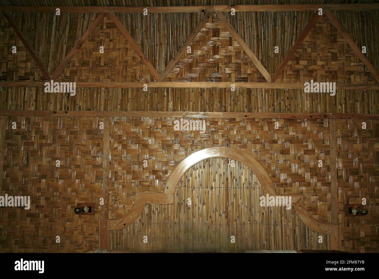 Interior of room decorated with cane wood panelling Stock Photo - Alamy