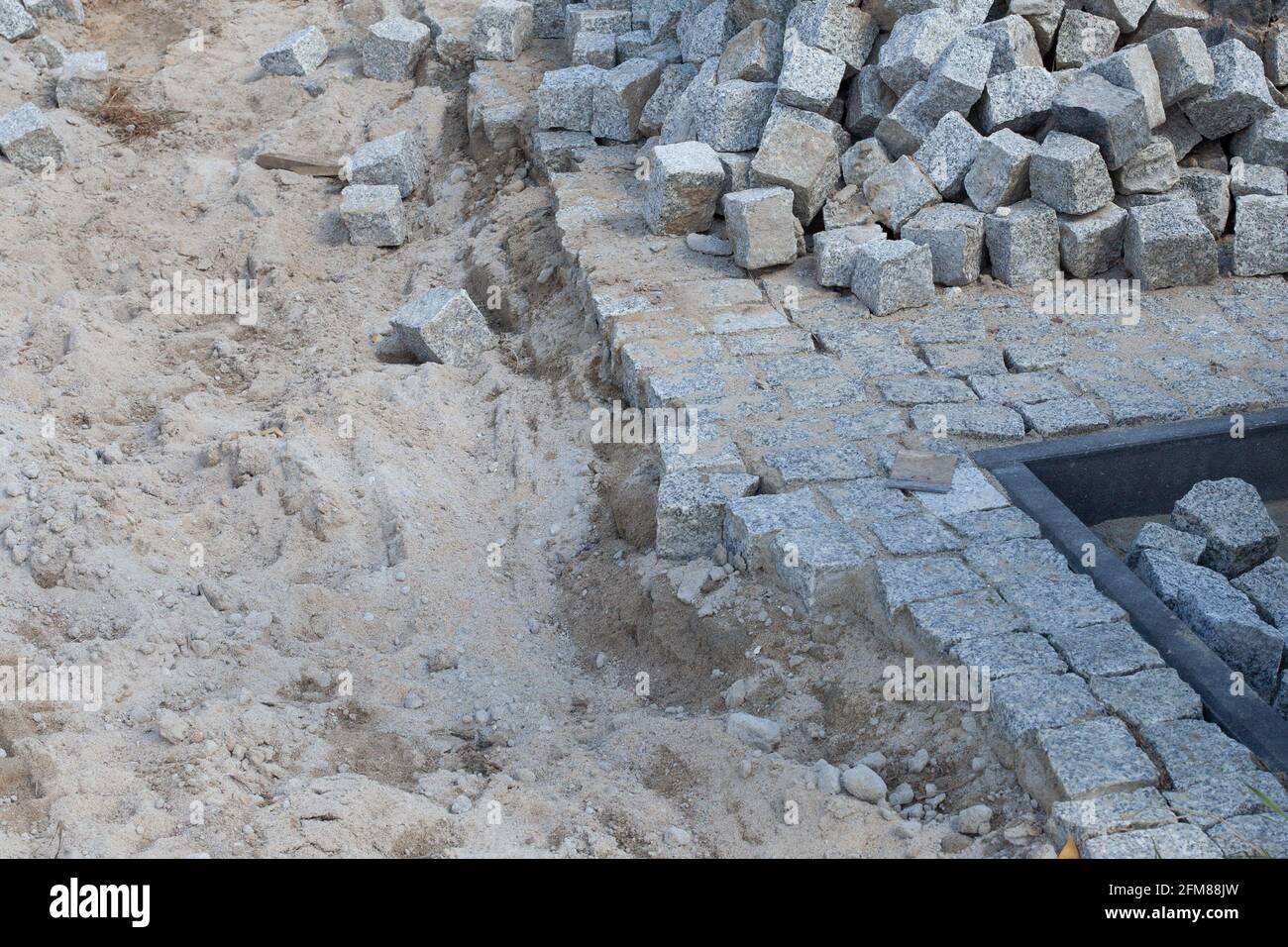Demolition of a stone pavement Stock Photo - Alamy