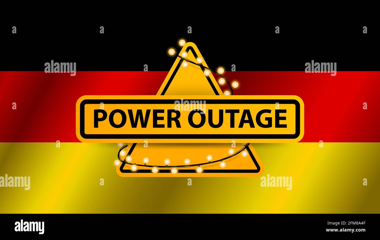 Power outage, yellow warning sign wrapped with garland on the ...