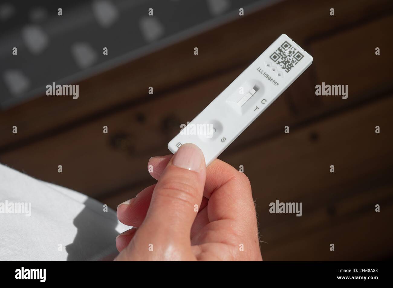 The NHS issued lateral flow test for testing at home in the UK. Shown ...