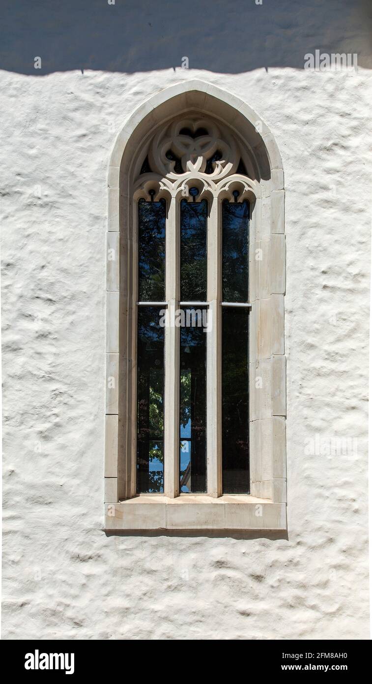 Old window in a monastery on the clean white plastered wall Stock Photo ...