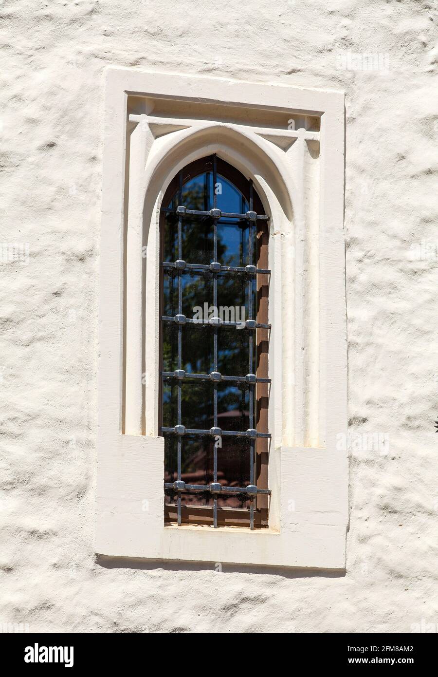 old Castle window with bars on a white wall Stock Photo - Alamy