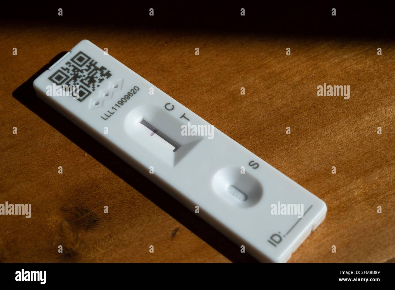 The NHS issued lateral flow test for testing at home in the UK. Shown ...