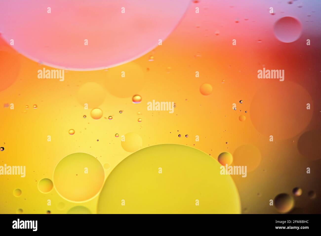 Colorful abstract background with oil drops on water Stock Photo - Alamy