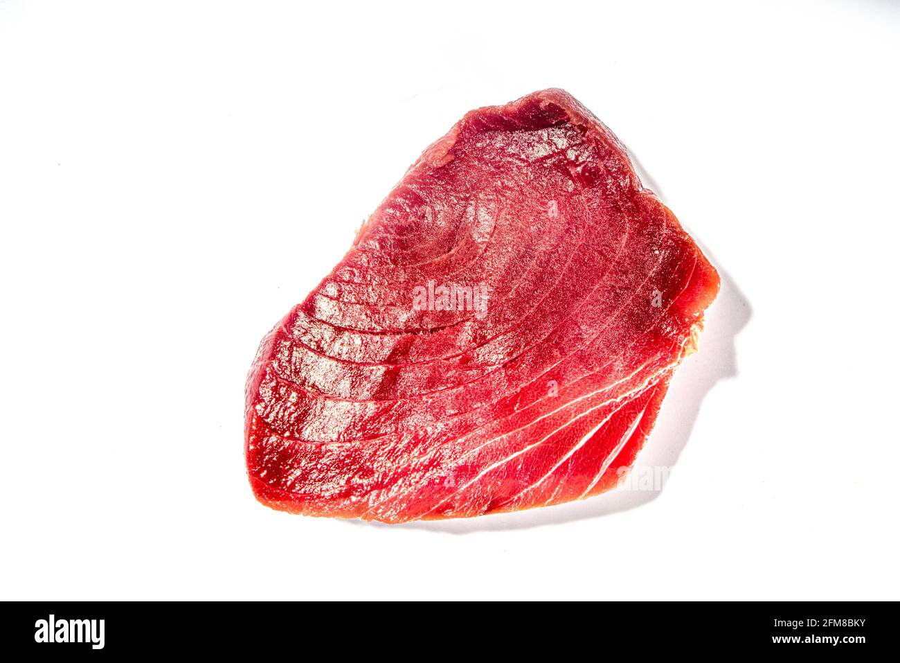Raw red tuna fish steak isolated on white background Stock Photo - Alamy