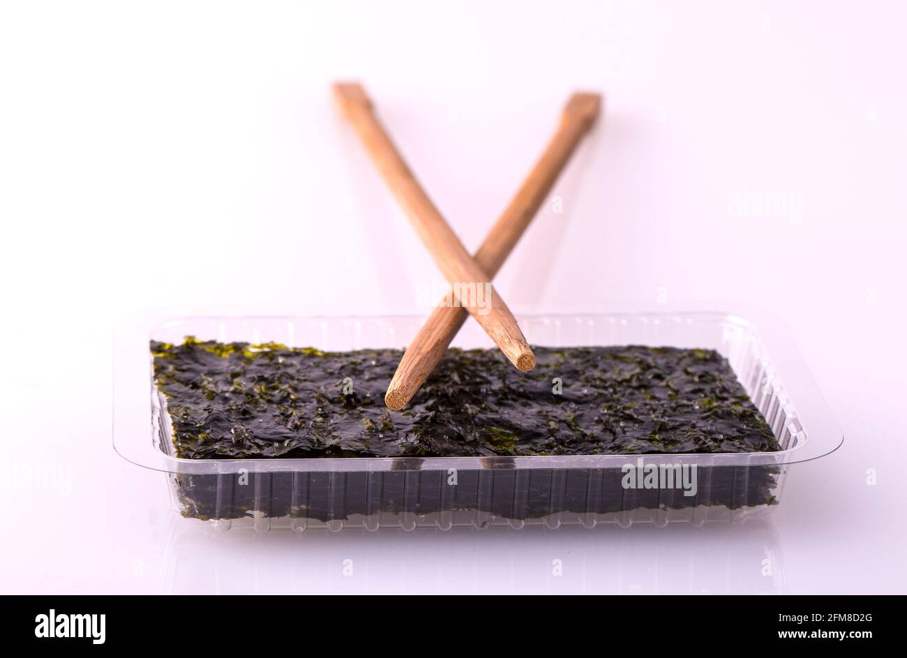 Nori sheets/Nori sheets with sticks on the white background Stock Photo ...
