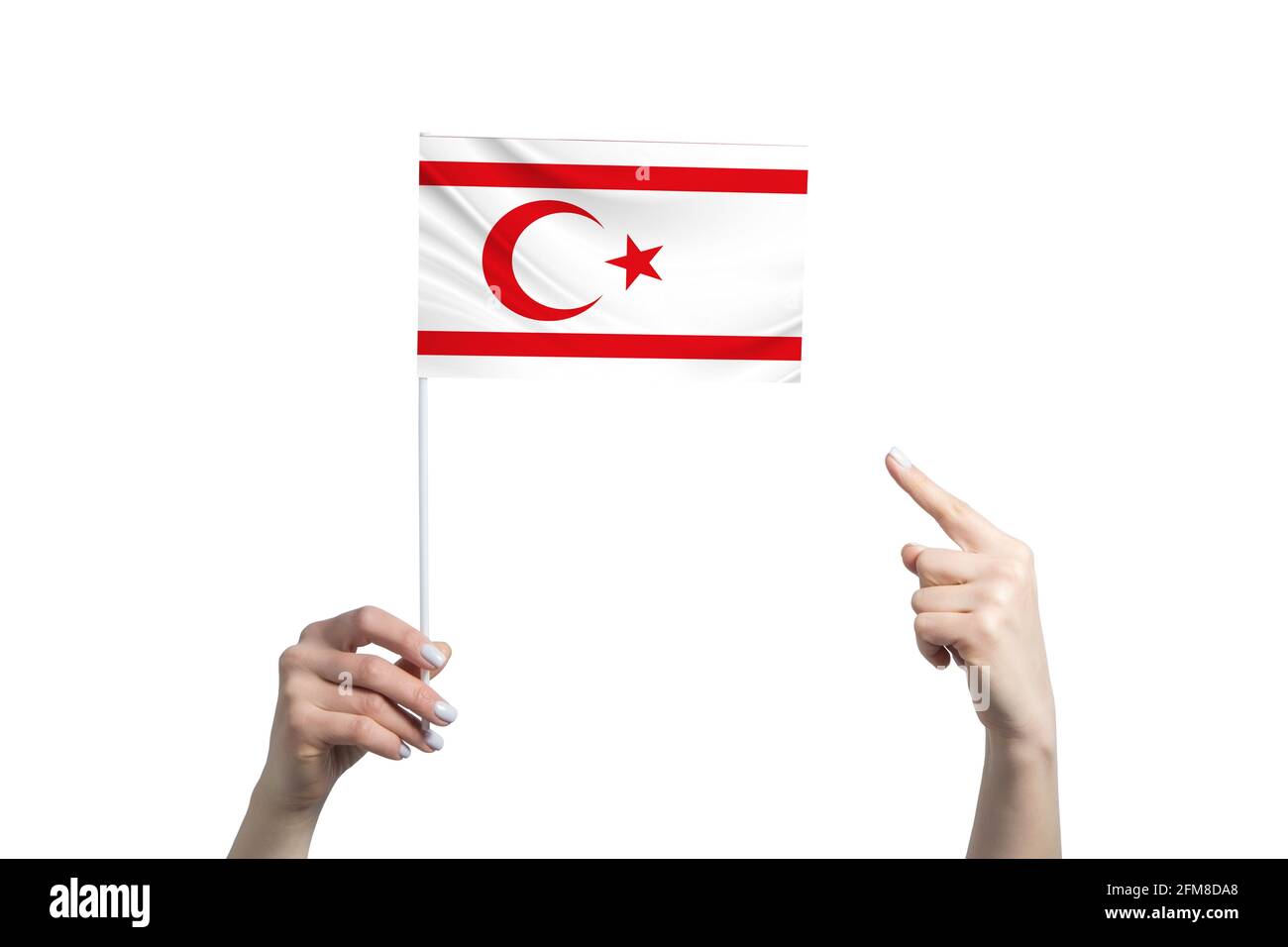 A beautiful female hand holds a Turkish Republic of Northern Cyprus ...