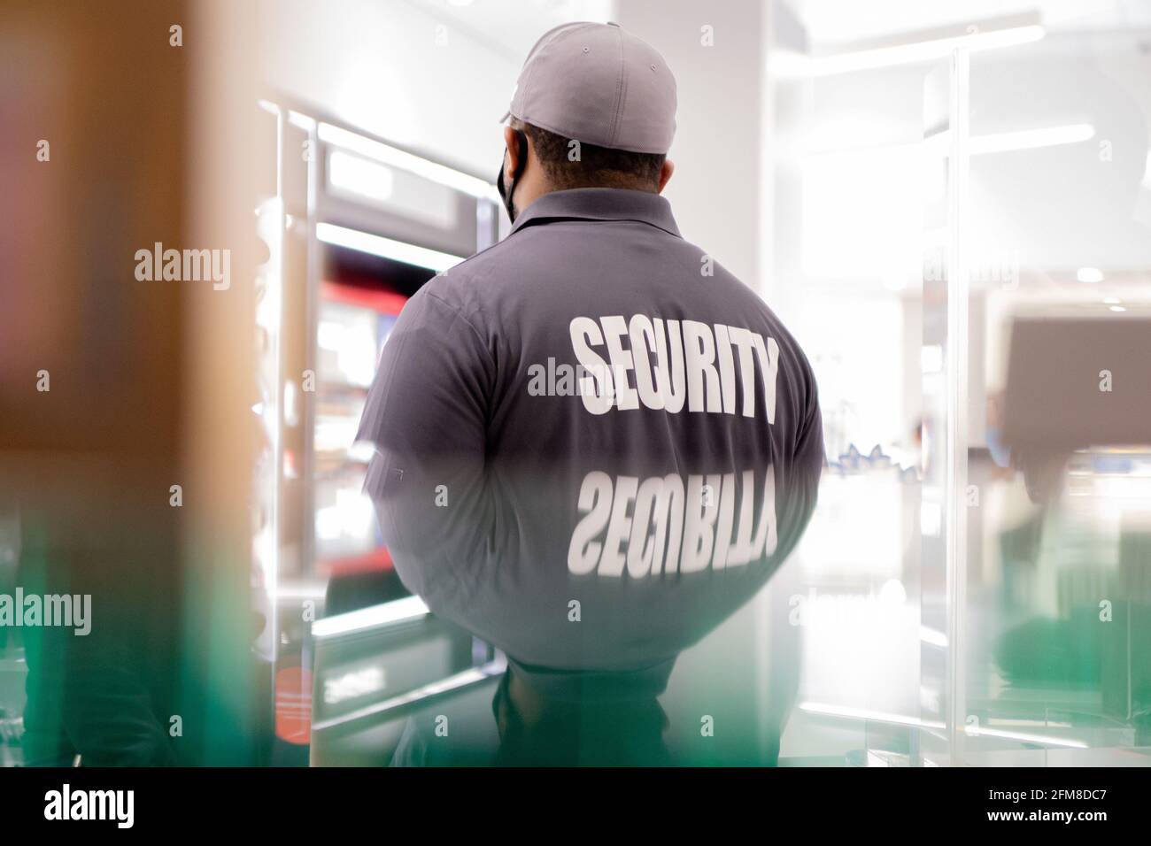 Standing uniform security guard authority hi-res stock photography and ...