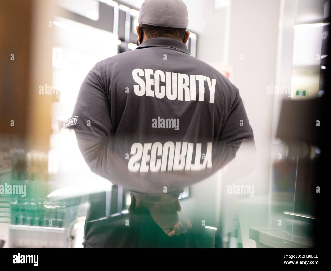 Standing uniform security guard authority hi-res stock photography and ...
