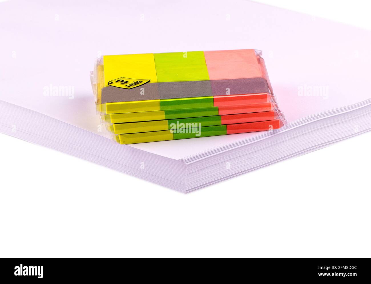 collection of colorful post it paper note on a stack of white paper ...