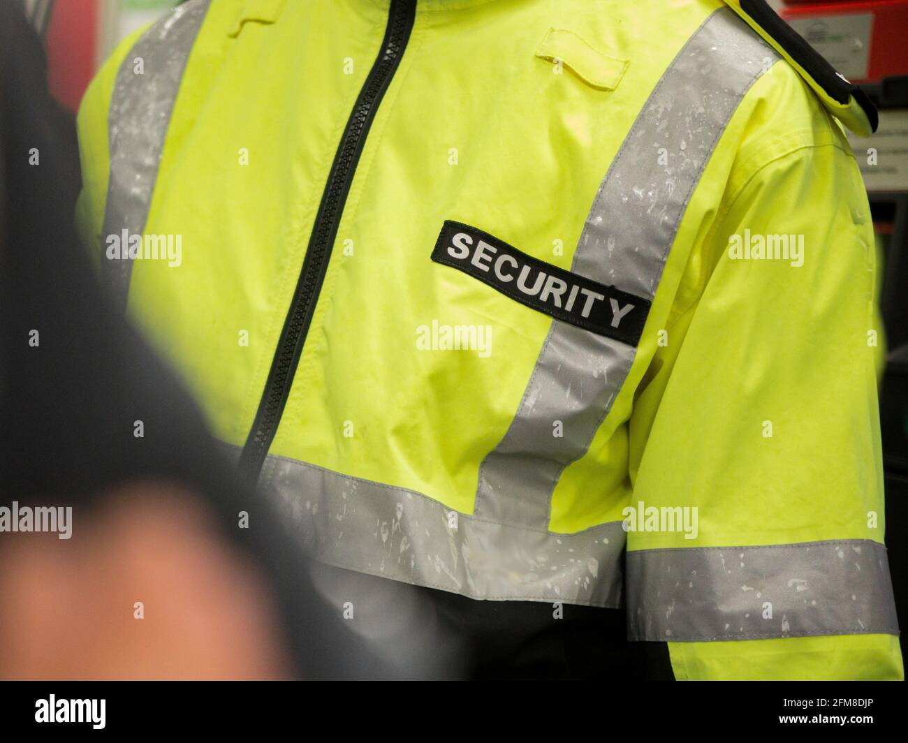 Security guard in uniform patrolling in commercial mall Stock Photo - Alamy
