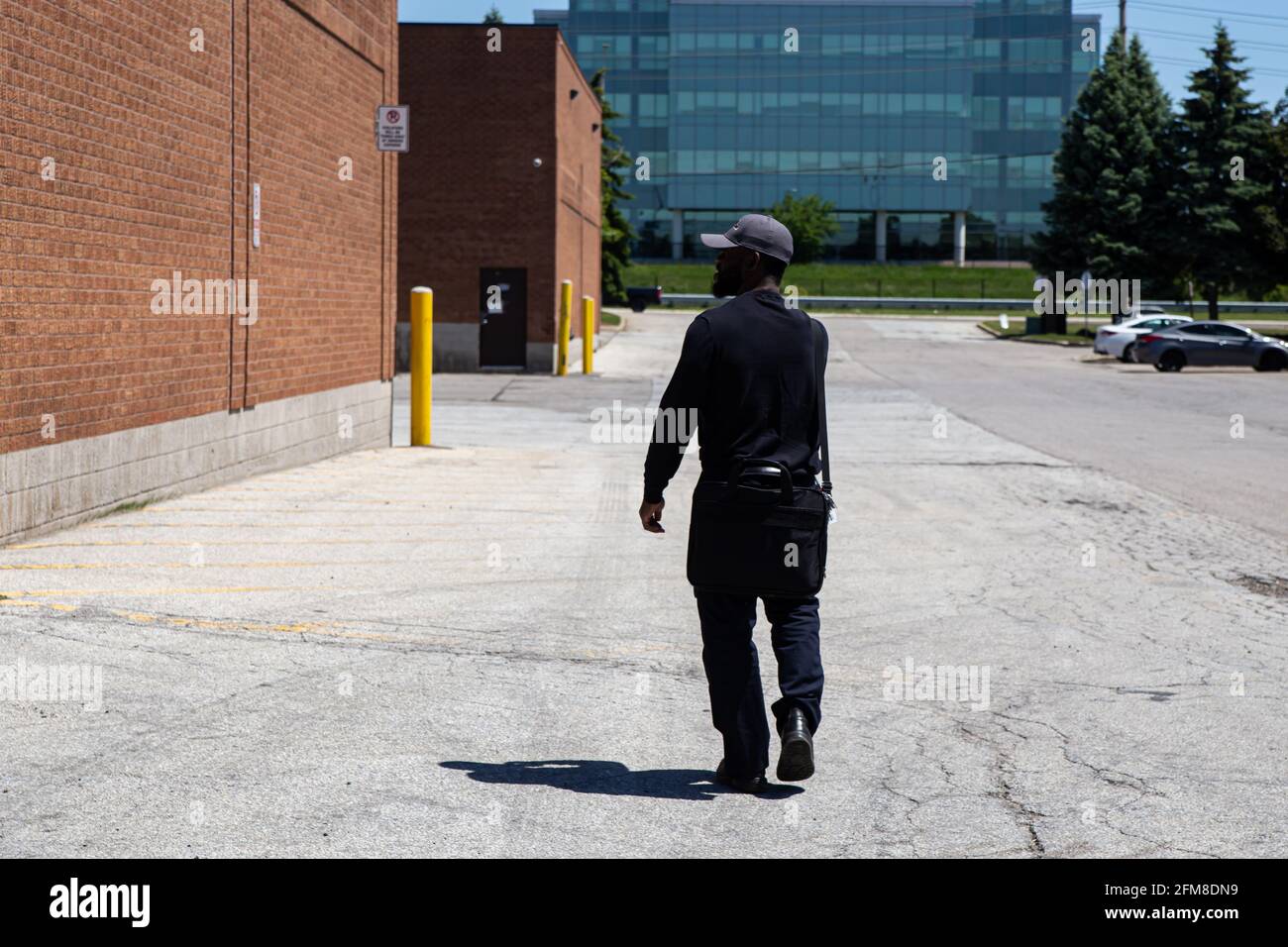 A rear view of parking security watching over parking area. Security ...