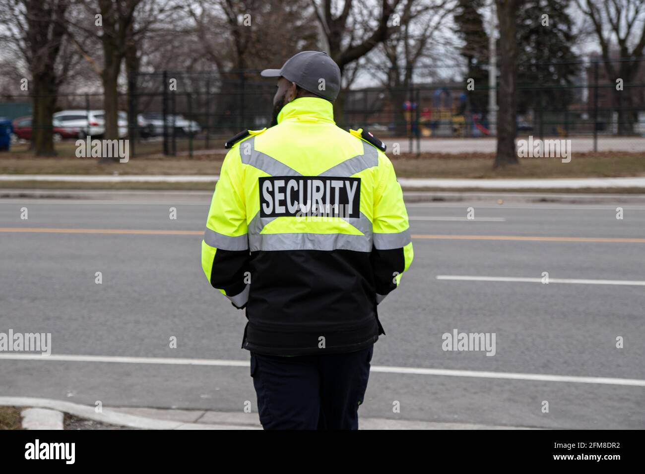 A rear view of parking security watching over parking area. Security ...