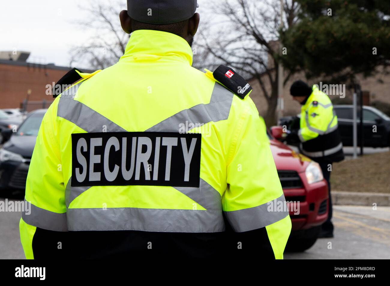 A rear view of parking security watching over parking area. Security ...