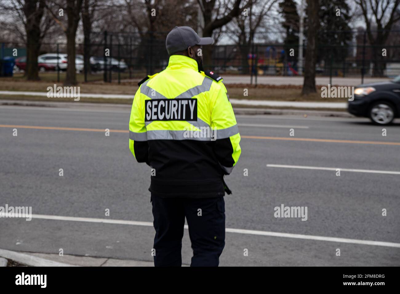 A rear view of parking security watching over parking area. Security ...