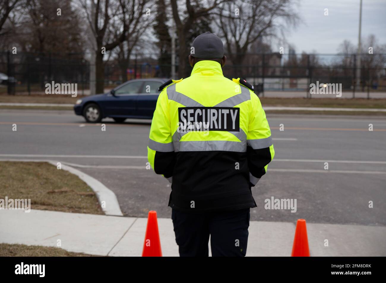 A rear view of parking security watching over parking area. Security ...