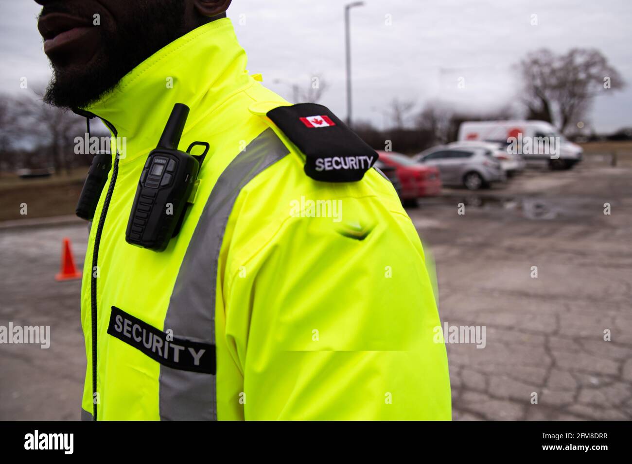 Parking security is watching over parking area. Security guard is ...