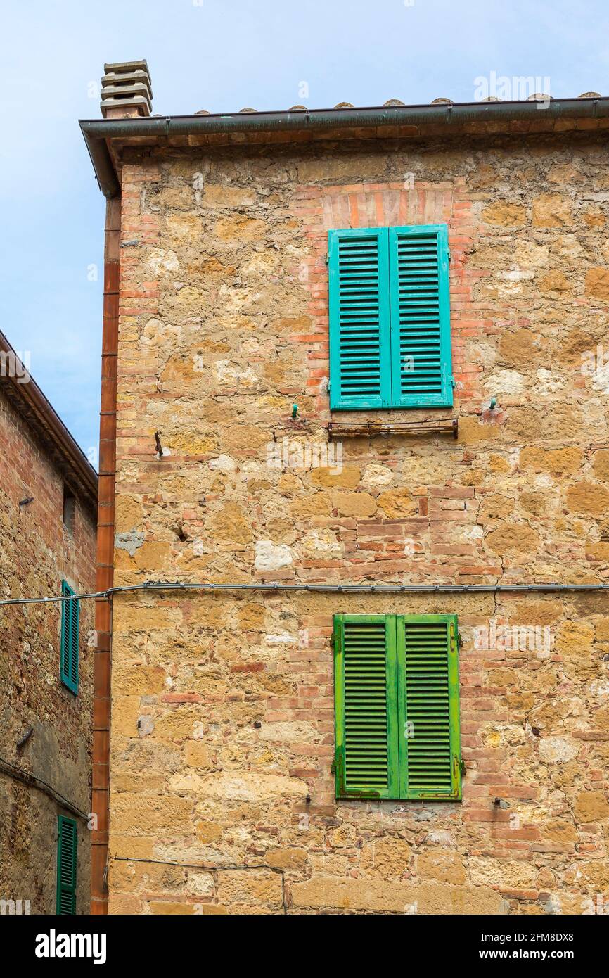 Italian house with closed colorful shutters Stock Photo - Alamy