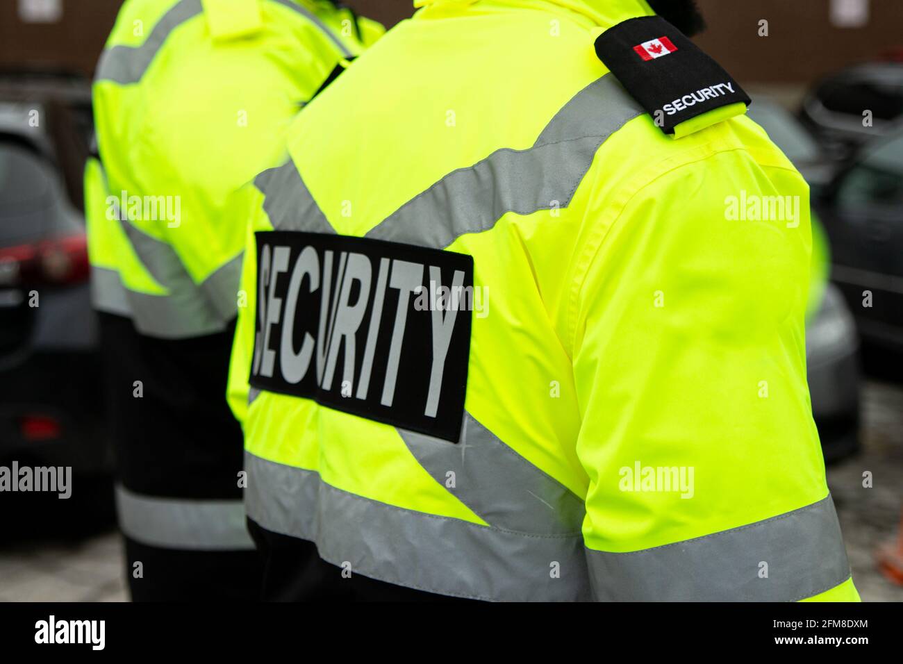 A rear view of parking security watching over parking area. Security ...
