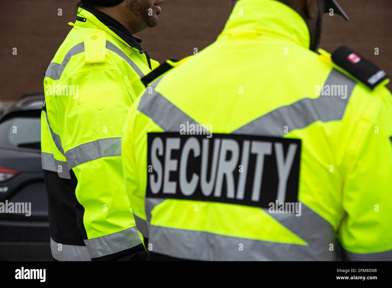 A rear view of parking security watching over parking area. Security ...