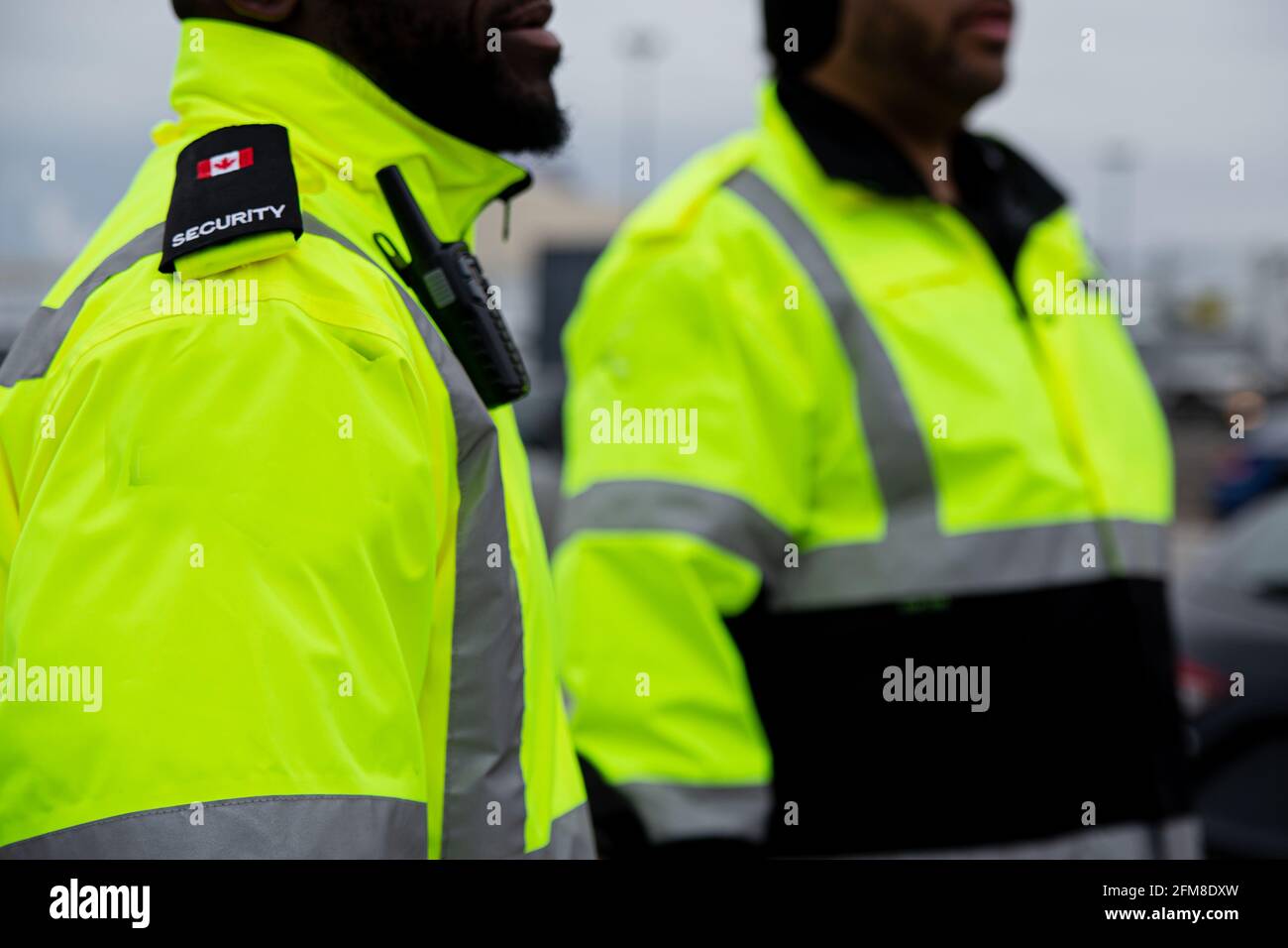 Parking security is watching over parking area. Security guard is ...