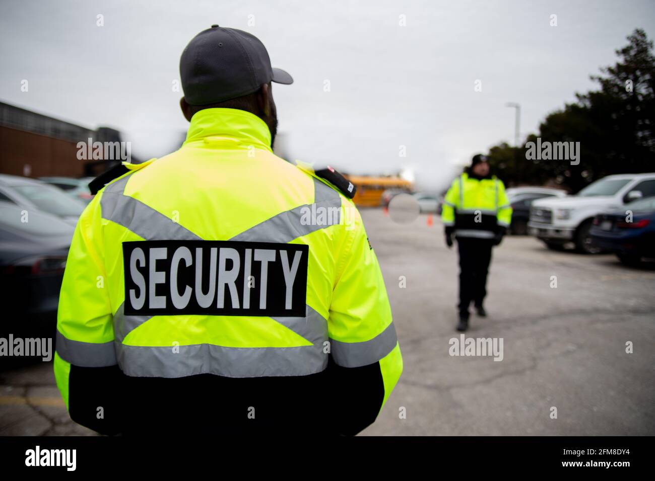 A rear view of parking security watching over parking area. Security ...