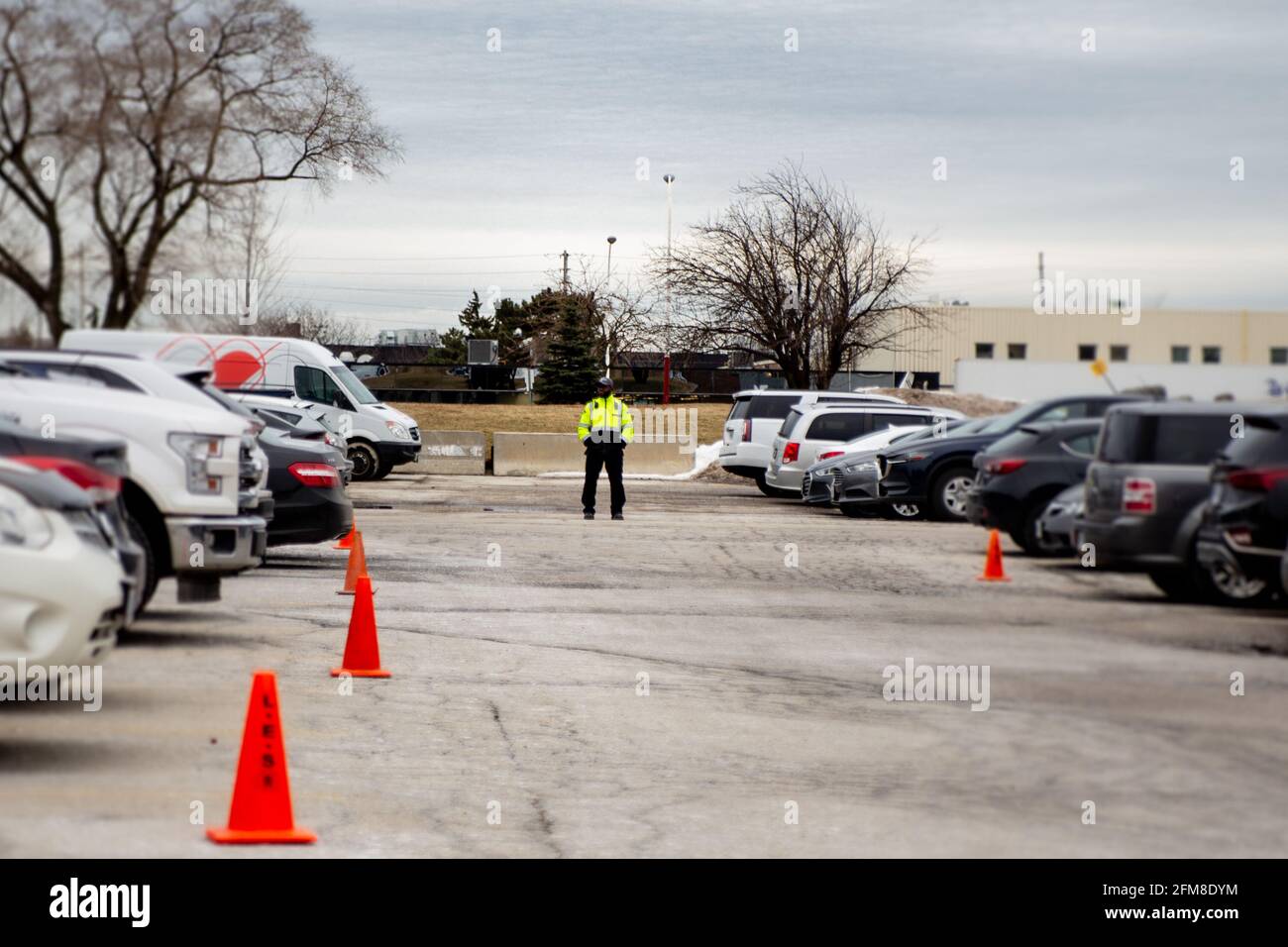Parking security is watching over parking area. Security guard is ...