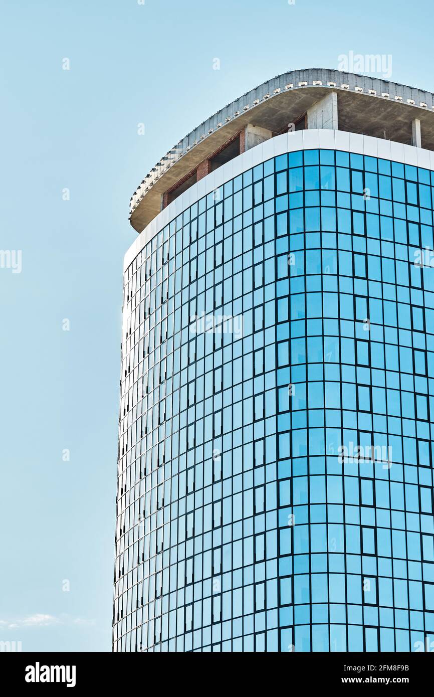 High new skyscraper building with shiny glass facade and lounge ground ...