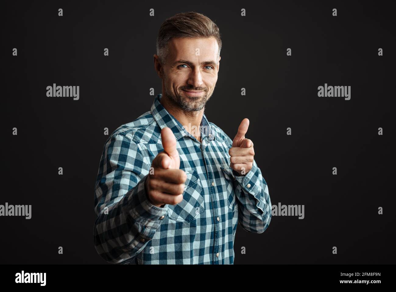 Picture of a handsome smiling grey-haired man pointing to you isolated ...
