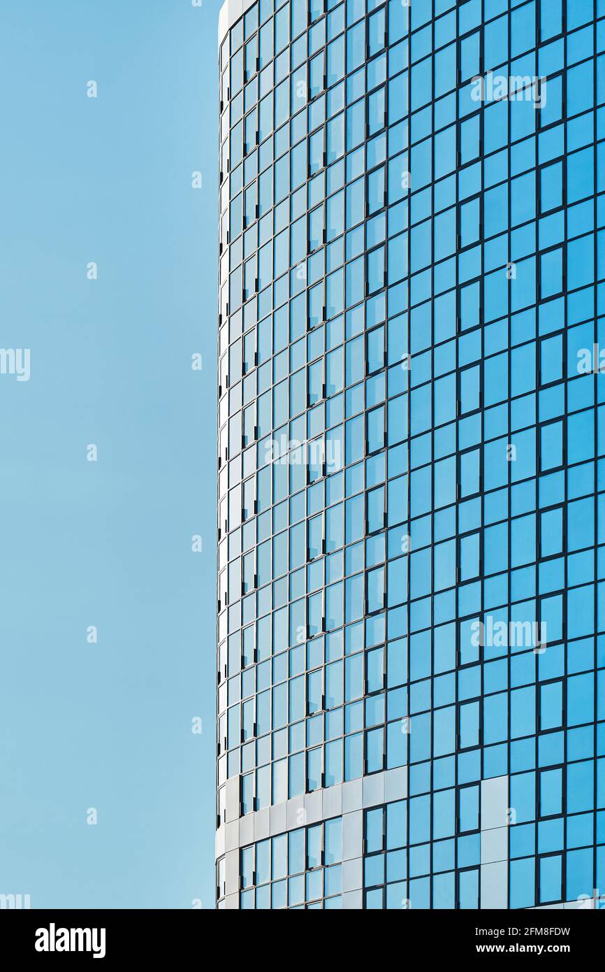 Stylish highrise office building with shiny blue glass facade ...