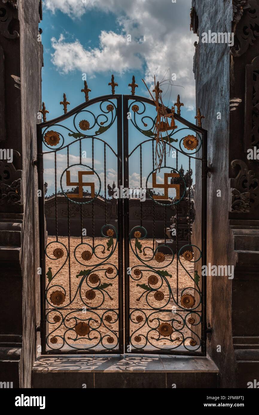 entry to Hindu Temple, iron gate decorated with swastika symbols ...