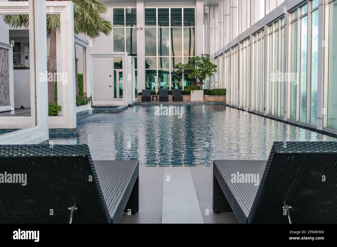A quiet swimming pool of a high rise apartment, taken just before ...