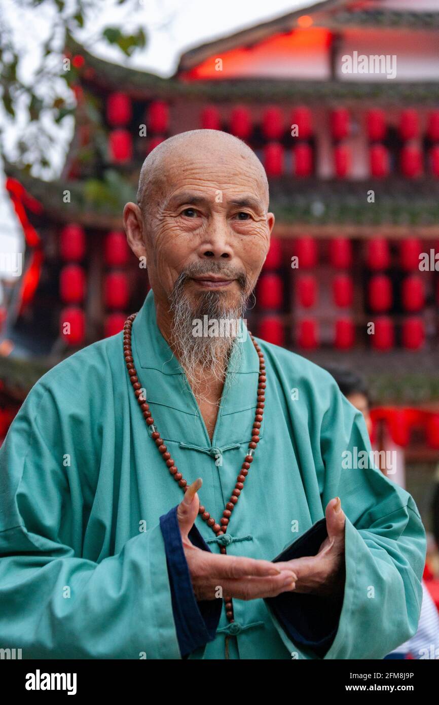 Elderly Chinese monk in the city of Leshan in the southern part of ...